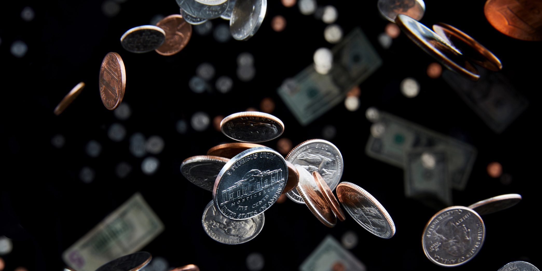 Falling coins reflect the economy and currency | Fynsa